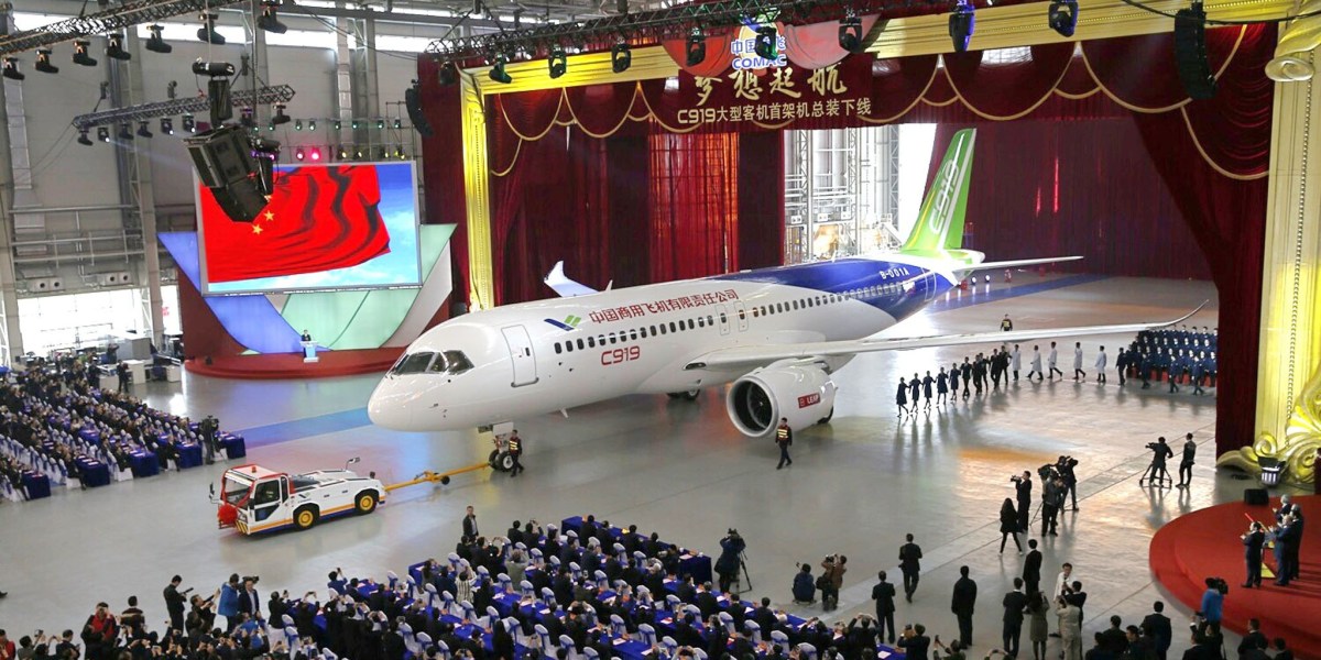 First China-made Passenger Jet Rolls Out Challenging Boeing, Airbus ...