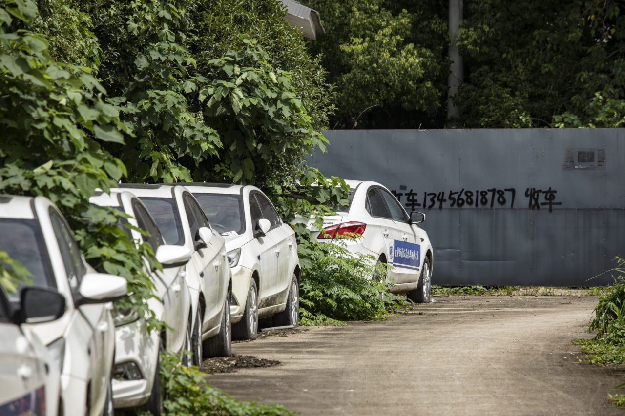 No one wants to buy used EVs and they’re piling up in weed-infested ...