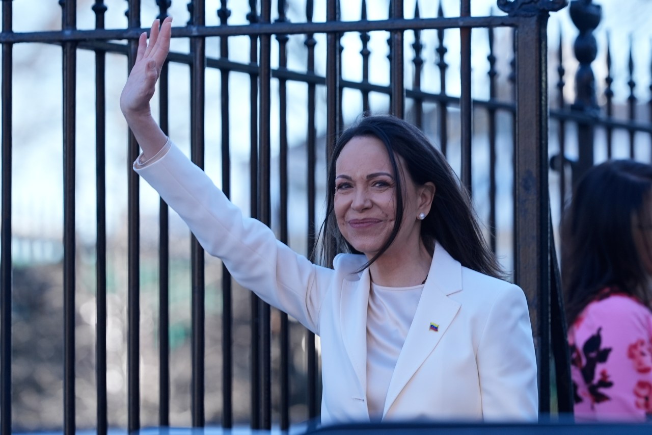 Venezuelan opposition leader María Corina Machado waves to supporters ...